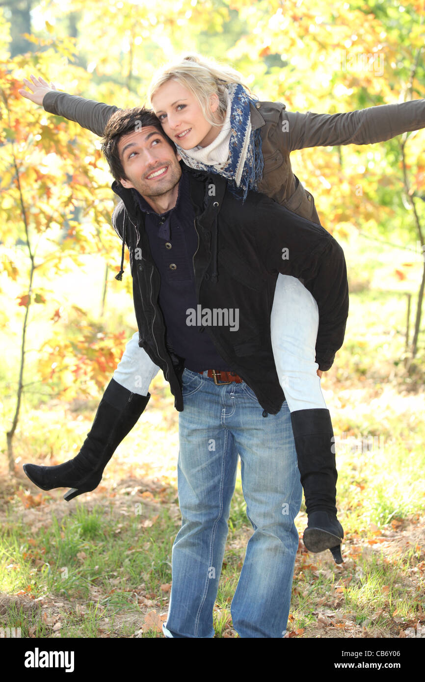 Wife giving husband piggy back hi-res stock photography and images - Alamy