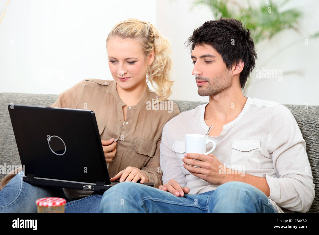 Couple on laptop Stock Photo - Alamy