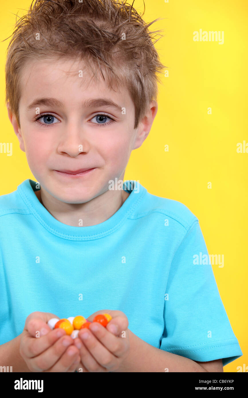 little boy receiving candies Stock Photo - Alamy