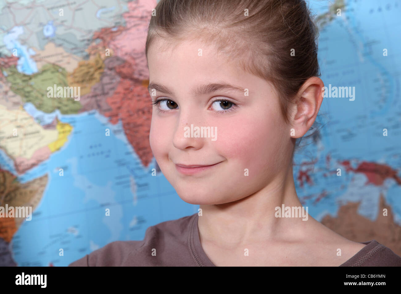 Girl in front of a world map Stock Photo - Alamy
