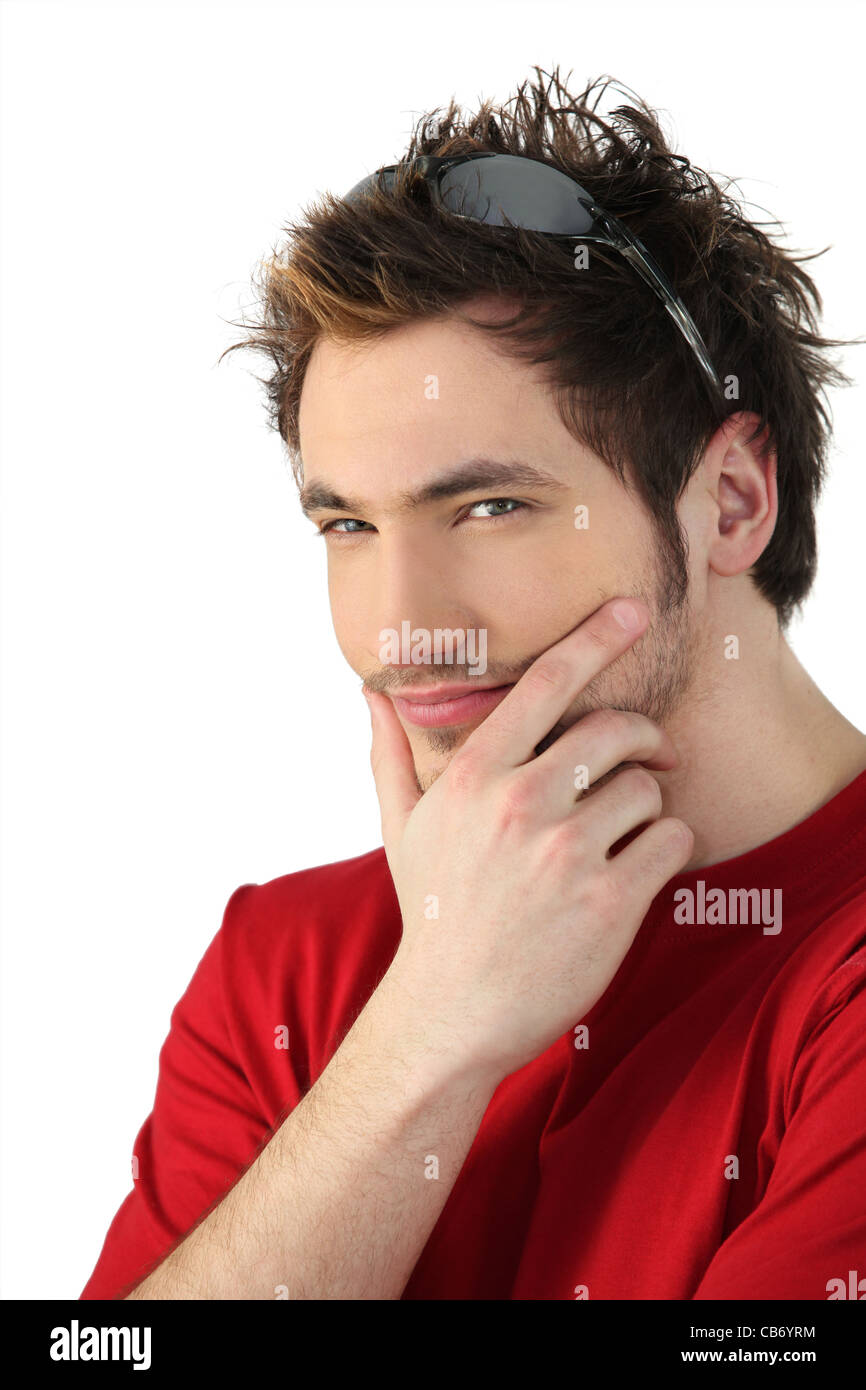 Portrait of a young man skeptical Stock Photo - Alamy