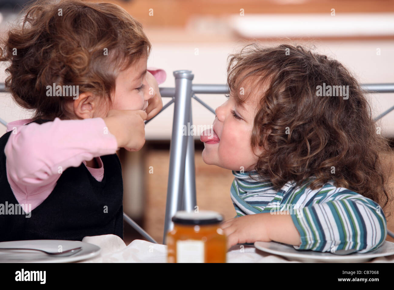 Children pulling faces Stock Photo - Alamy