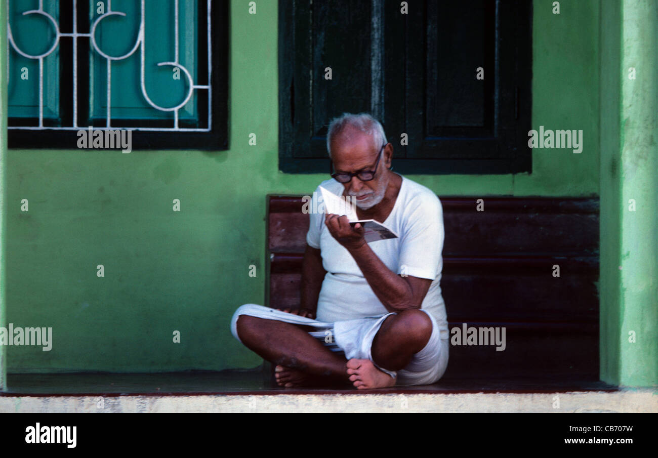 Indian Man Reading Book on Terrace of Green House, Pondicherry or ...