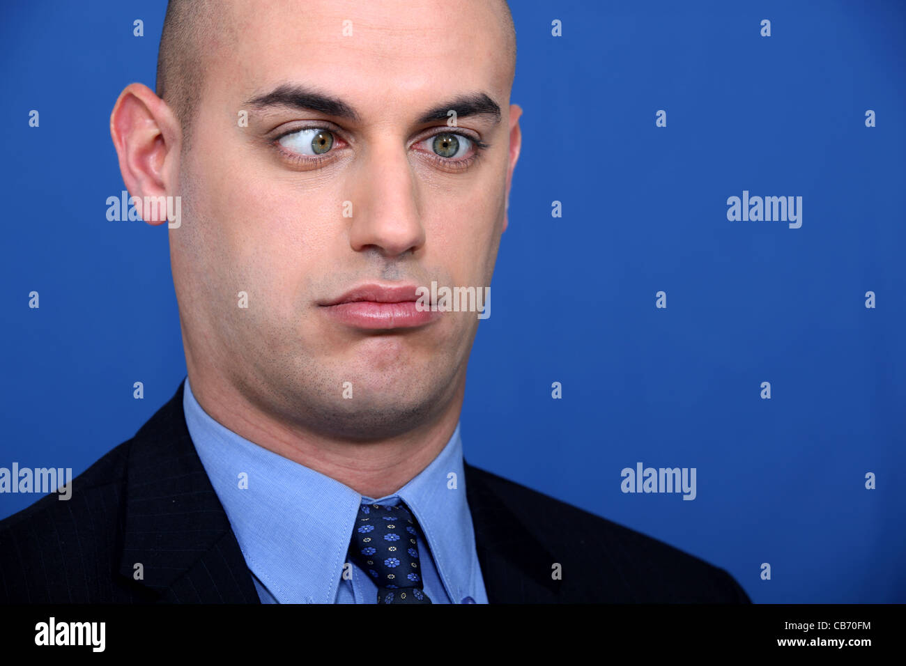 Corporate guy squinting Stock Photo - Alamy