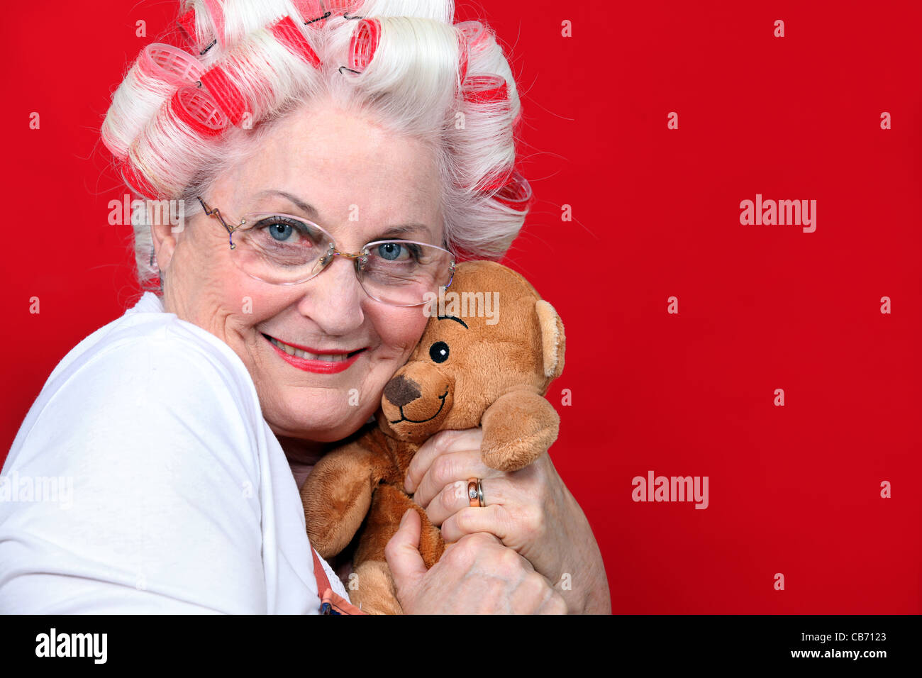 Old woman hugging teddy hi-res stock photography and images - Alamy