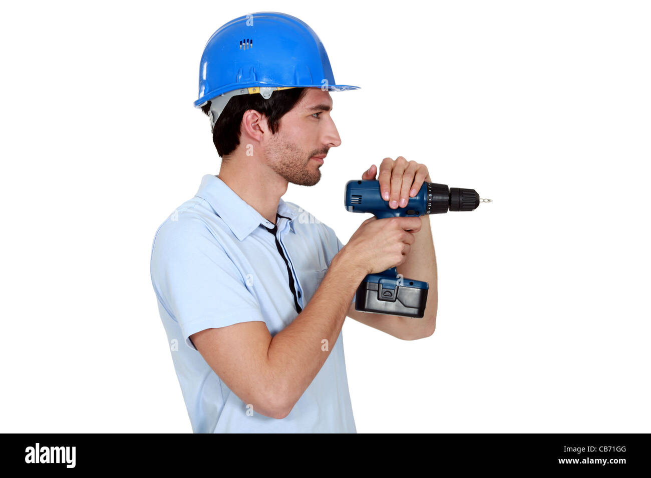 handyman in profile using drill Stock Photo - Alamy