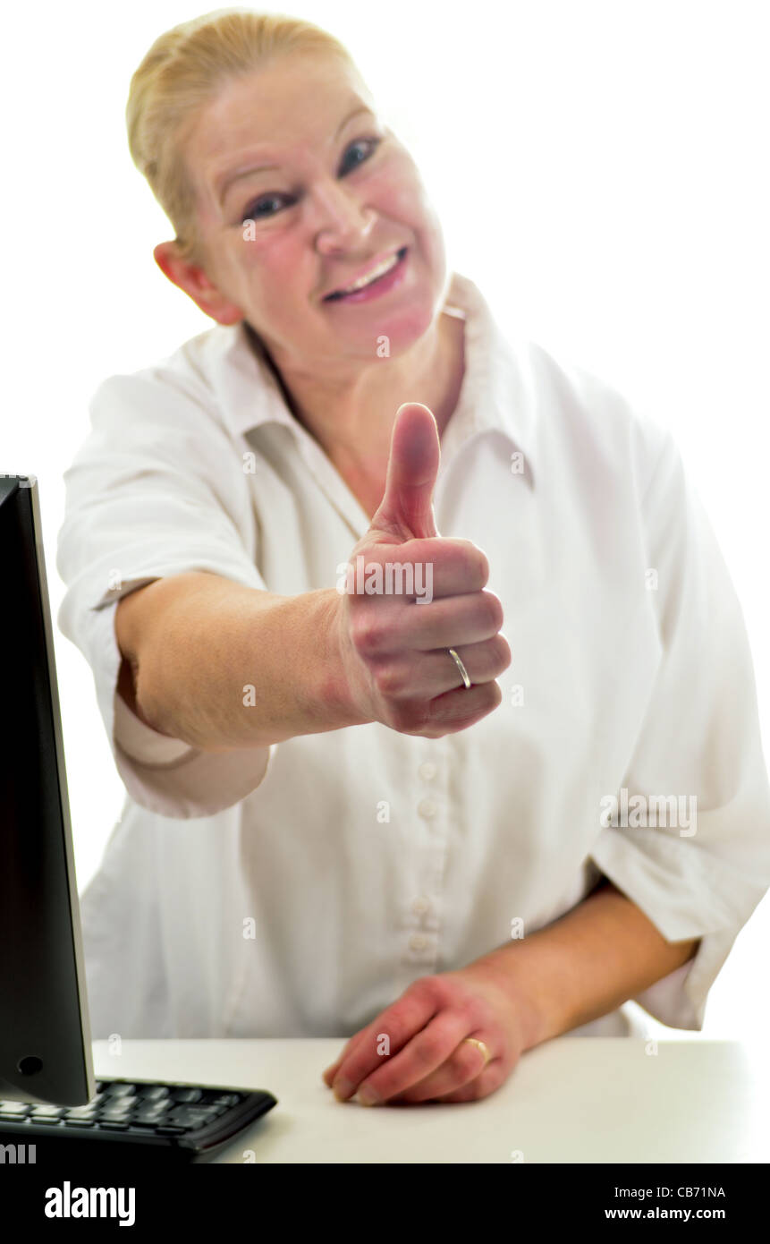 an office worker holding up the thumb as a positive sign Stock Photo ...