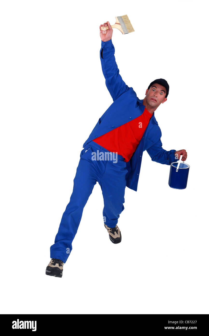 Shocked painter falling backwards Stock Photo - Alamy