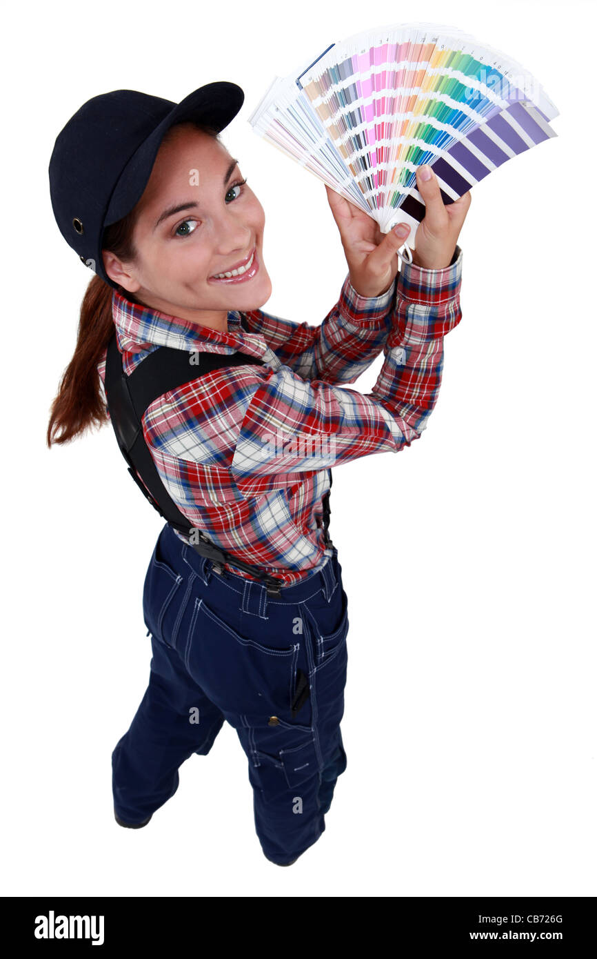 Woman holding up paint colour samples Stock Photo - Alamy