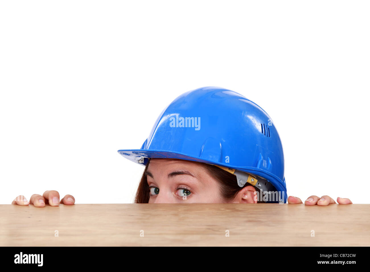 craftswoman hiding behind a table Stock Photo - Alamy