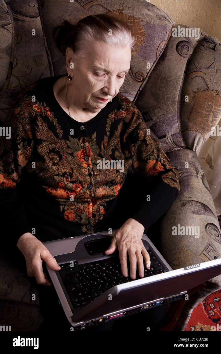 senior with laptop Stock Photo - Alamy