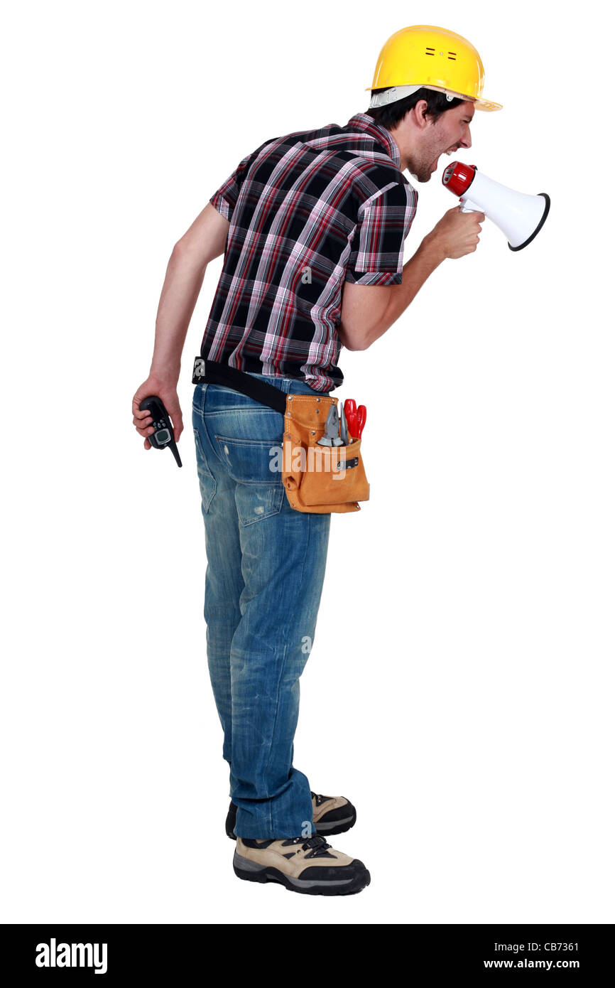 Construction worker shouting into a megaphone Stock Photo - Alamy