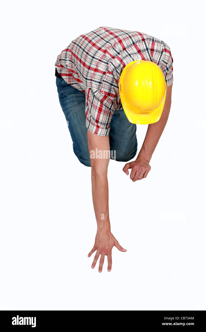 Bending down to pick up hi-res stock photography and images - Alamy
