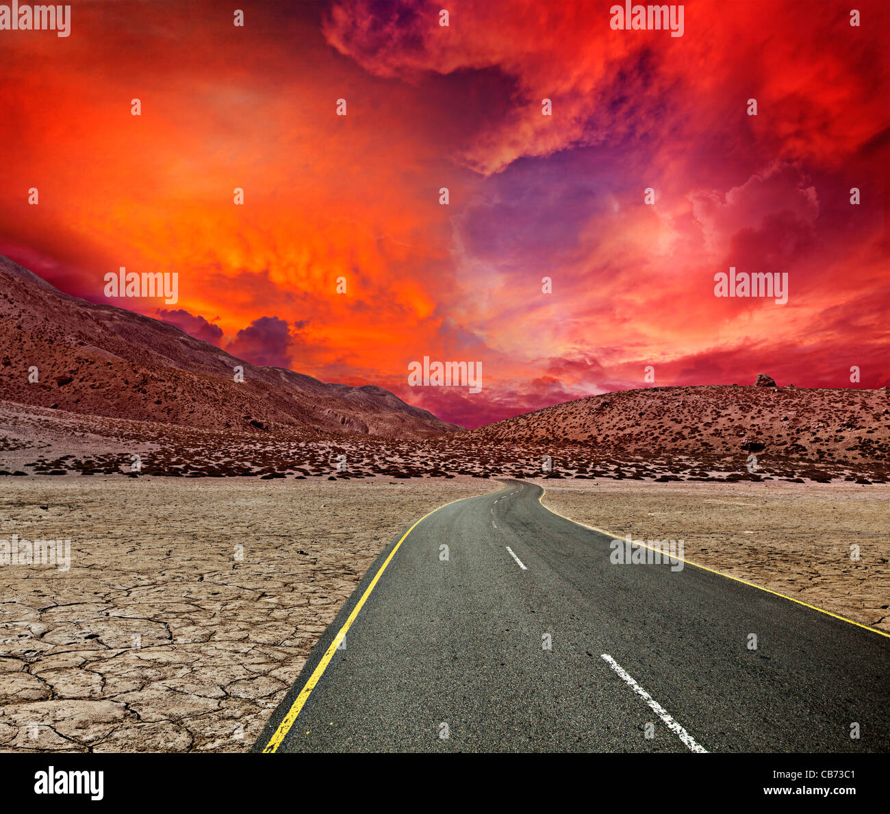 Road in desert on sunset Stock Photo - Alamy