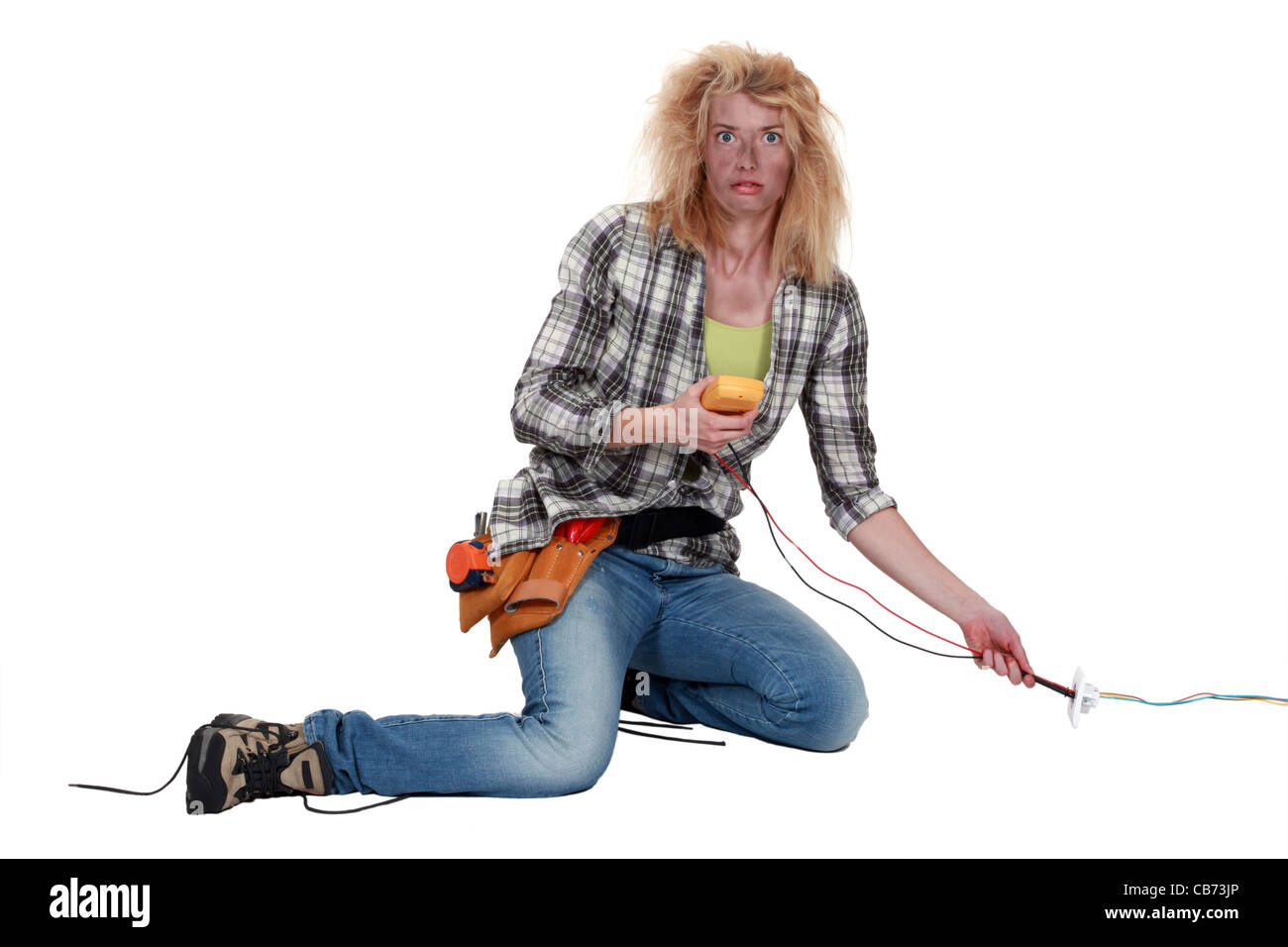 A shocked female electrician Stock Photo - Alamy