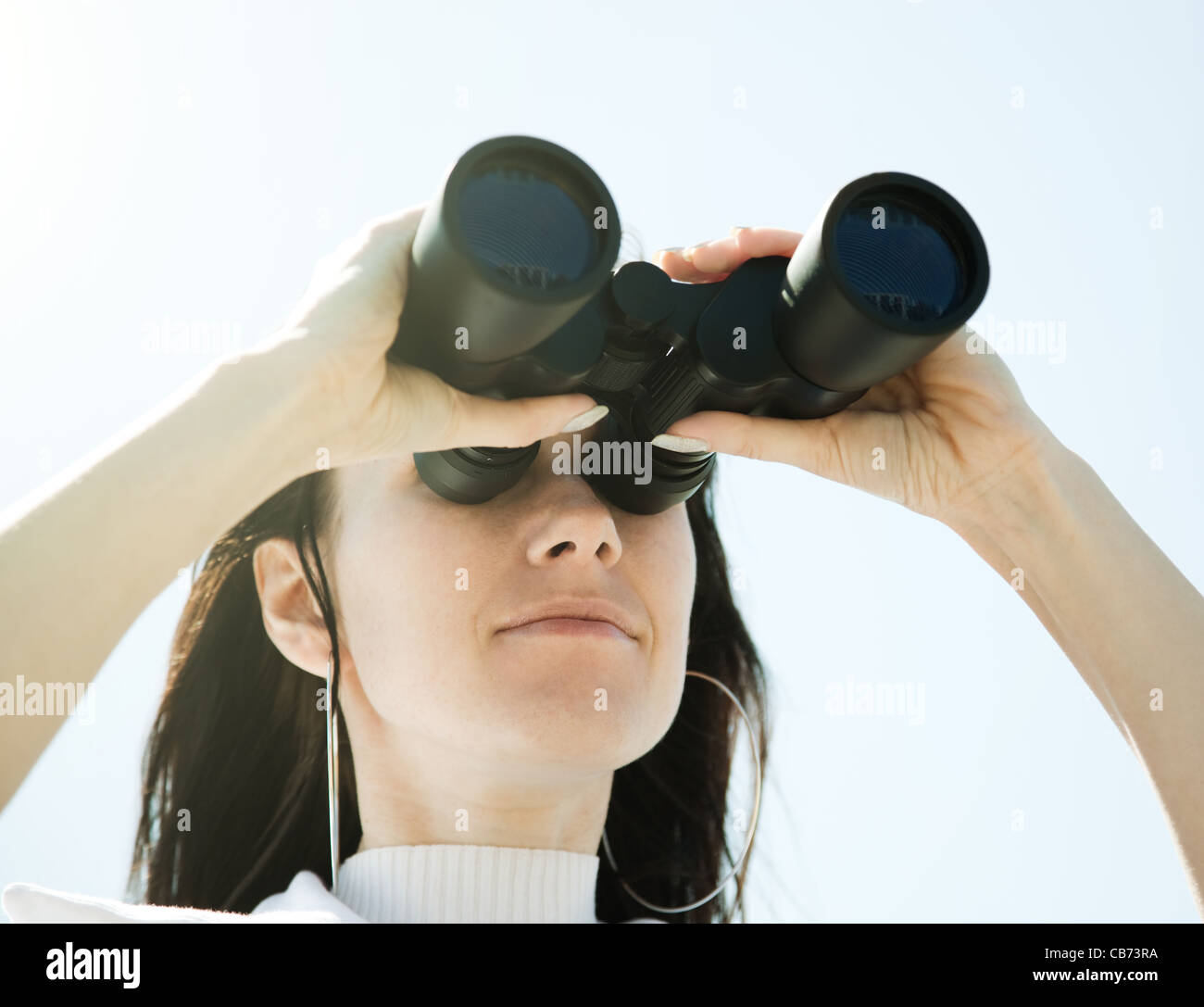 Girl with binocular Stock Photo - Alamy