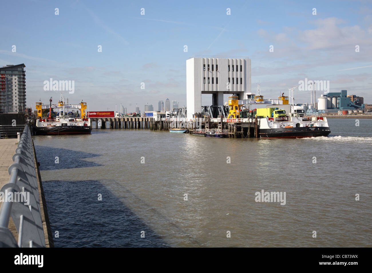 London's Woolwich Ferry leaves the south jetty fully loaded. Another ...