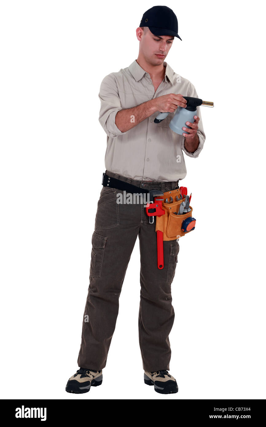 Man reading blow torch instructions Stock Photo - Alamy