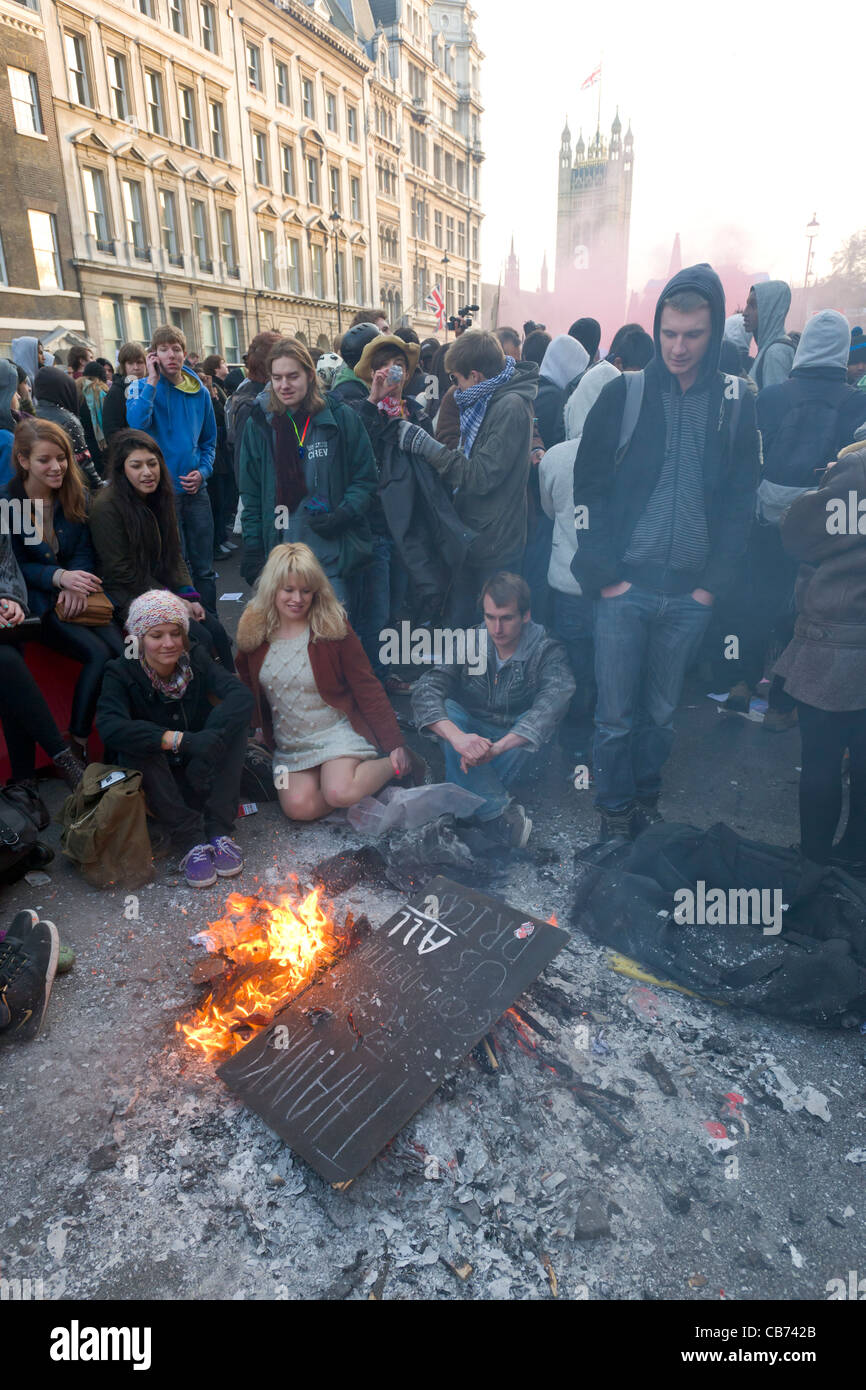Demonstration standing crowd burning building exterior hi-res stock ...
