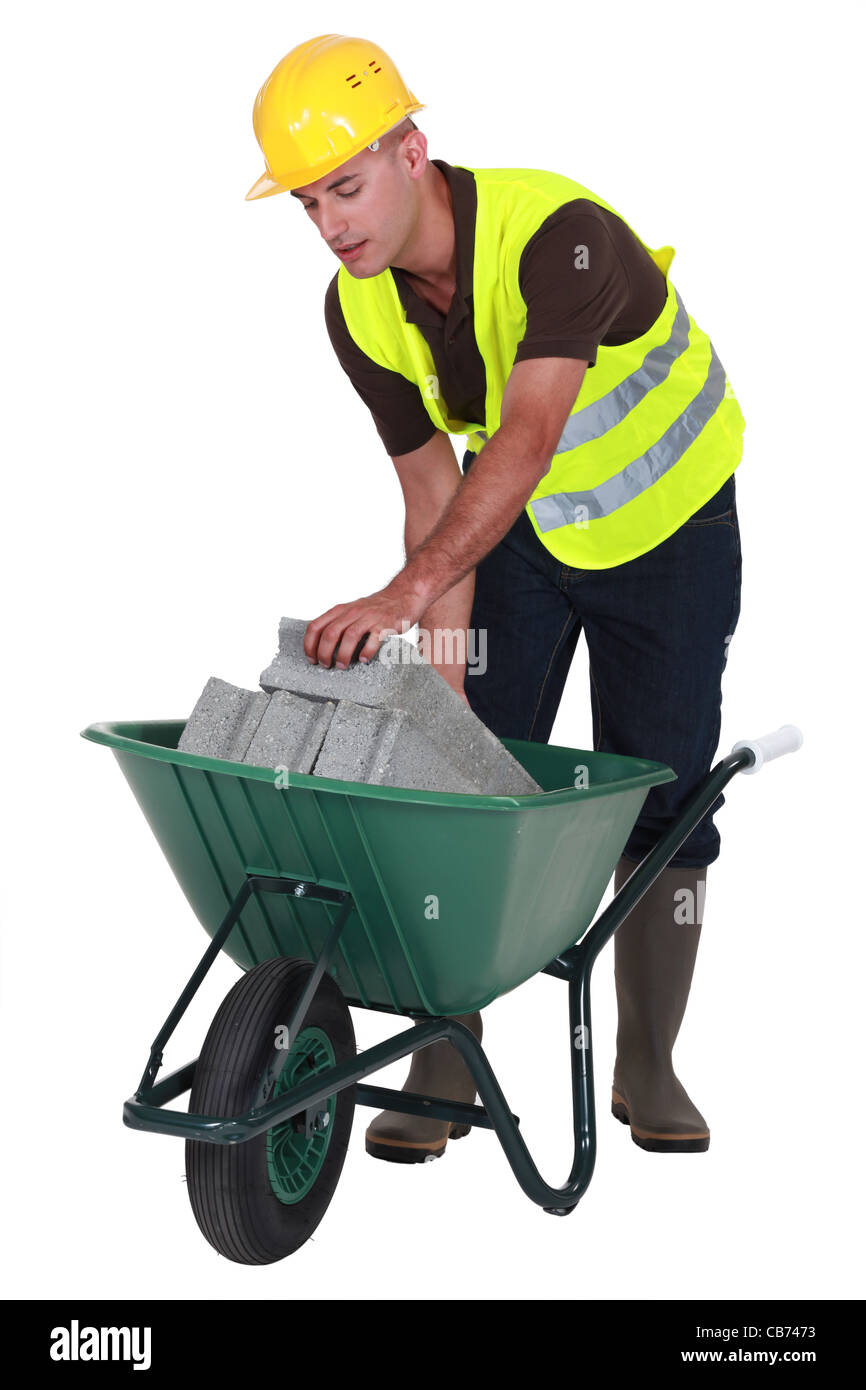 Construction site bricks in wheelbarrow hi-res stock photography and ...
