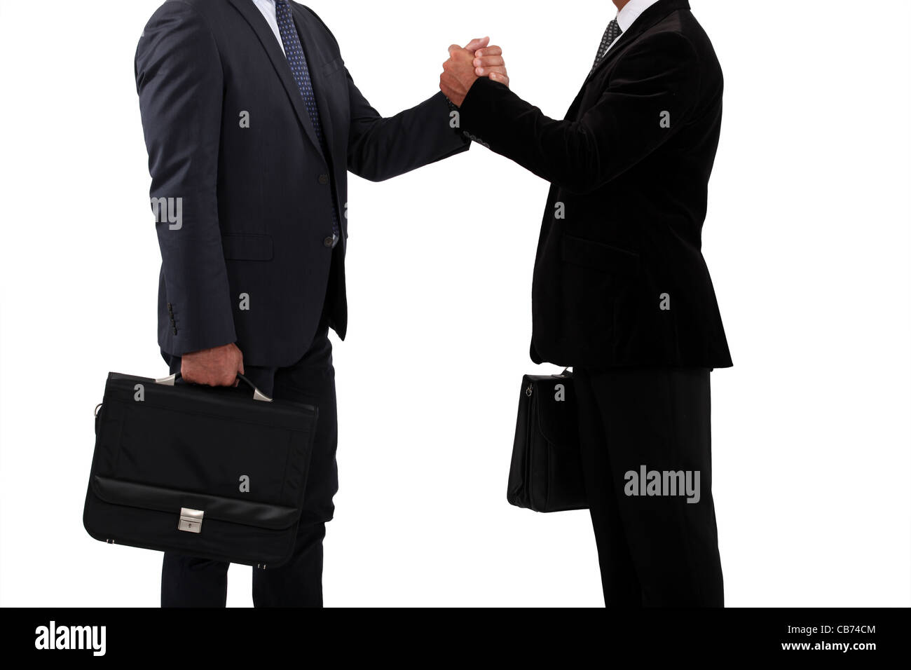 Handshaking businessmen Cut Out Stock Images & Pictures - Alamy