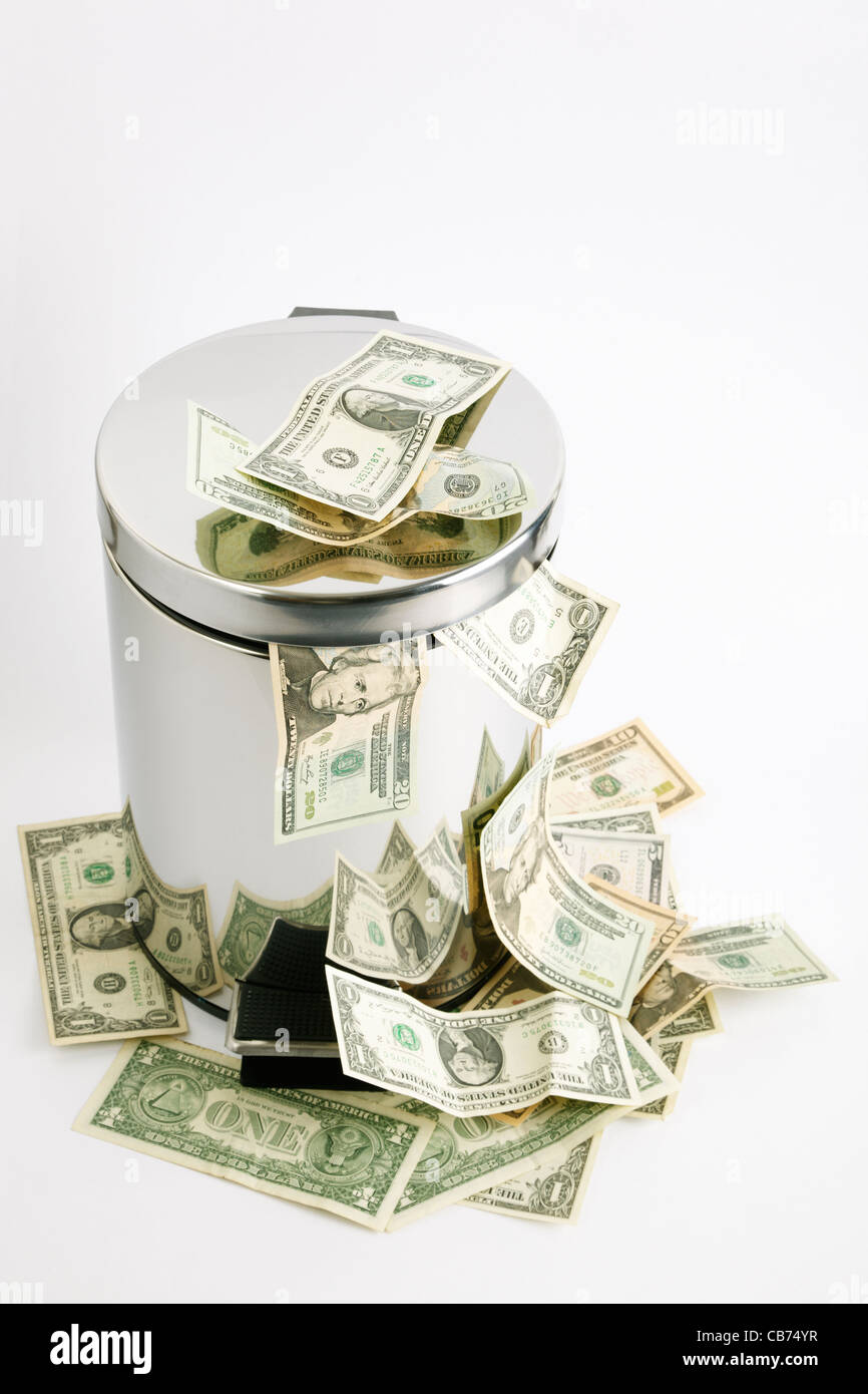 finance concept with money and metal tub on light grey background ...