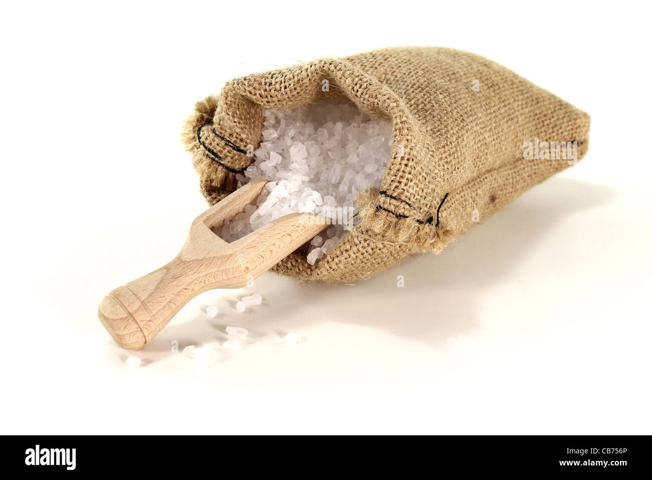 salt grains on a bushel with sea salt in the bag Stock Photo - Alamy