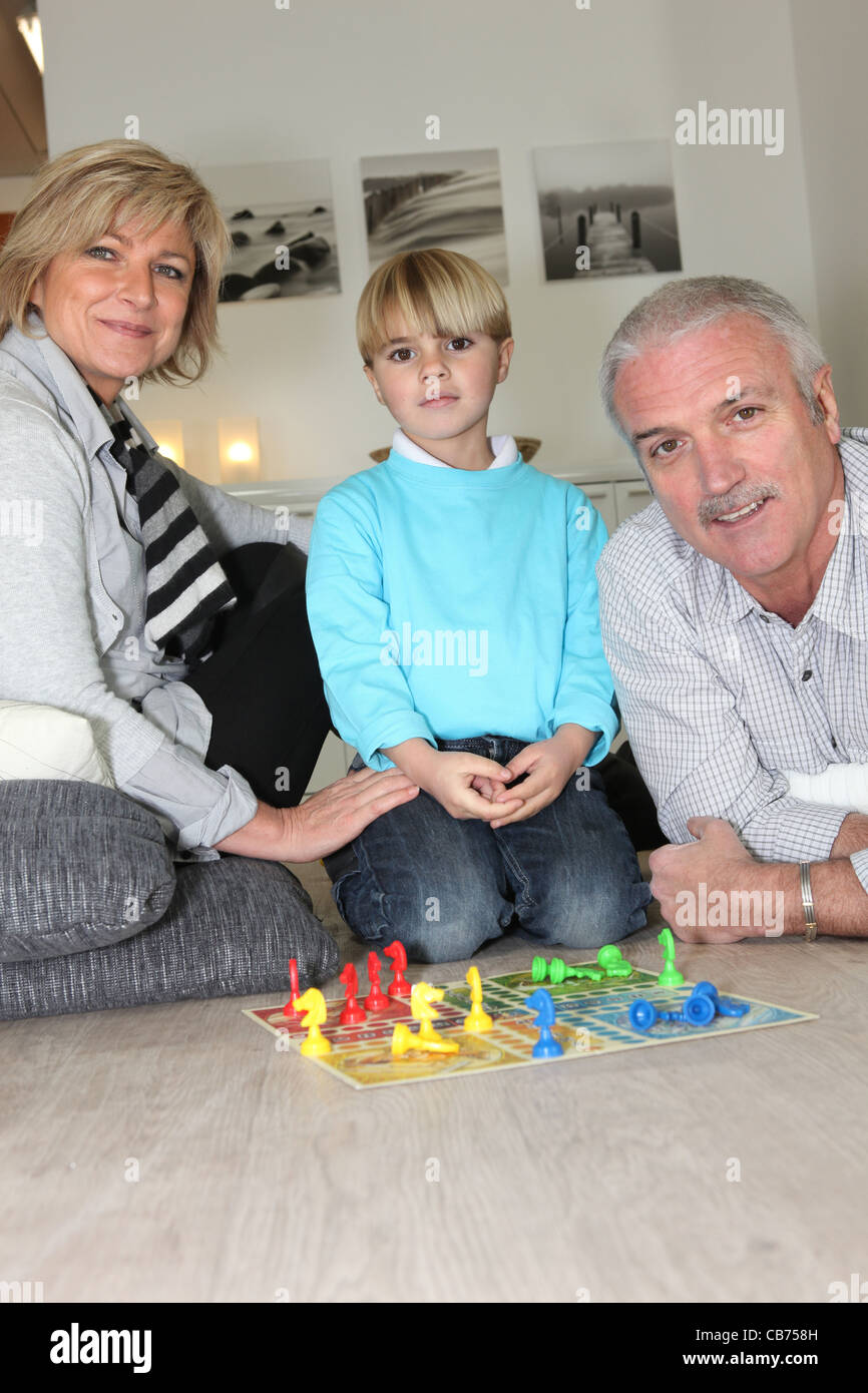 Family playing chess Stock Photo - Alamy