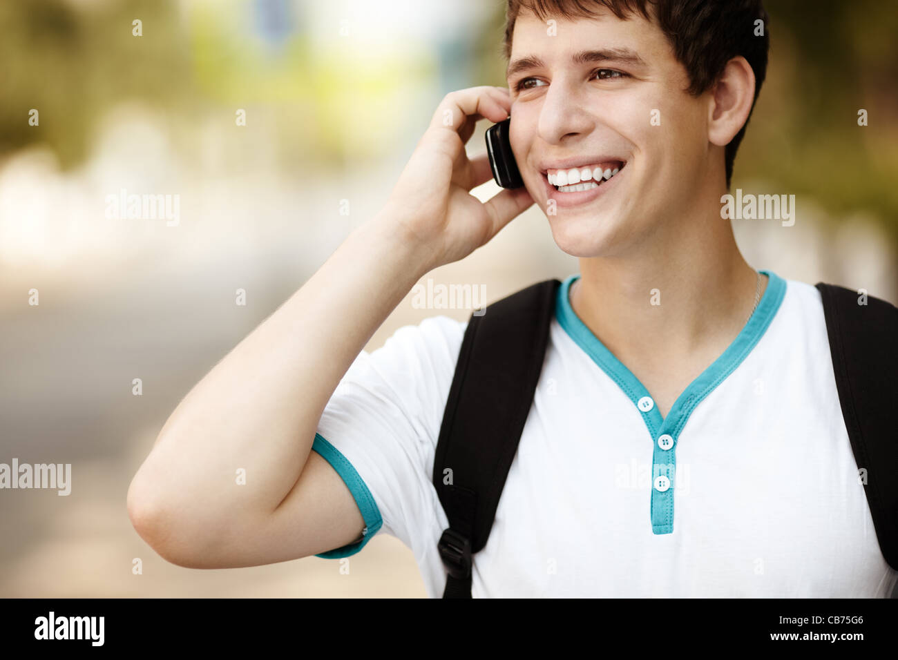 Portrait of young man with cell-phone Stock Photo - Alamy