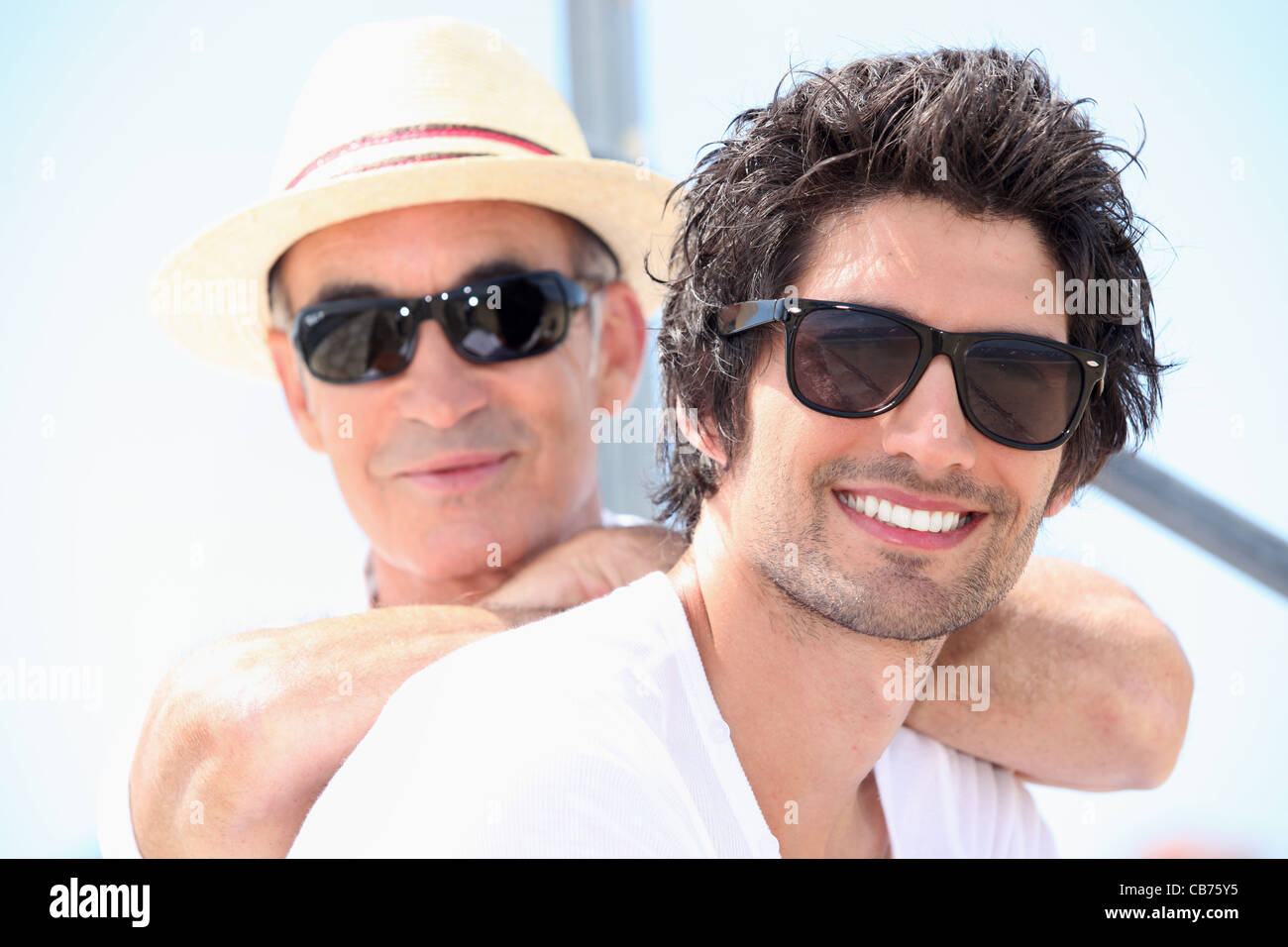 Father and son wearing sunglasses Stock Photo - Alamy