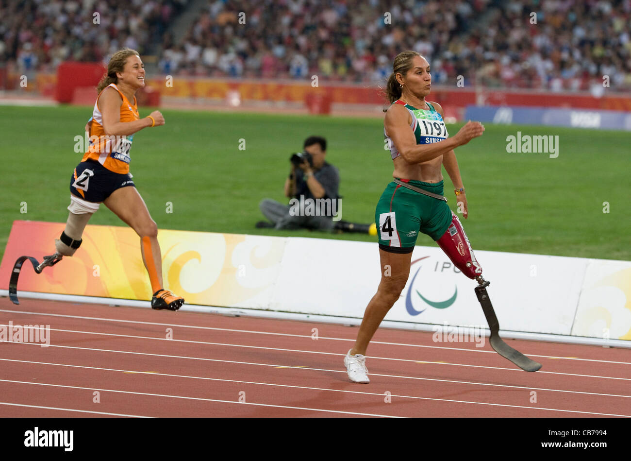 athletic competition at the 2008 Paralympic Games showing female ...