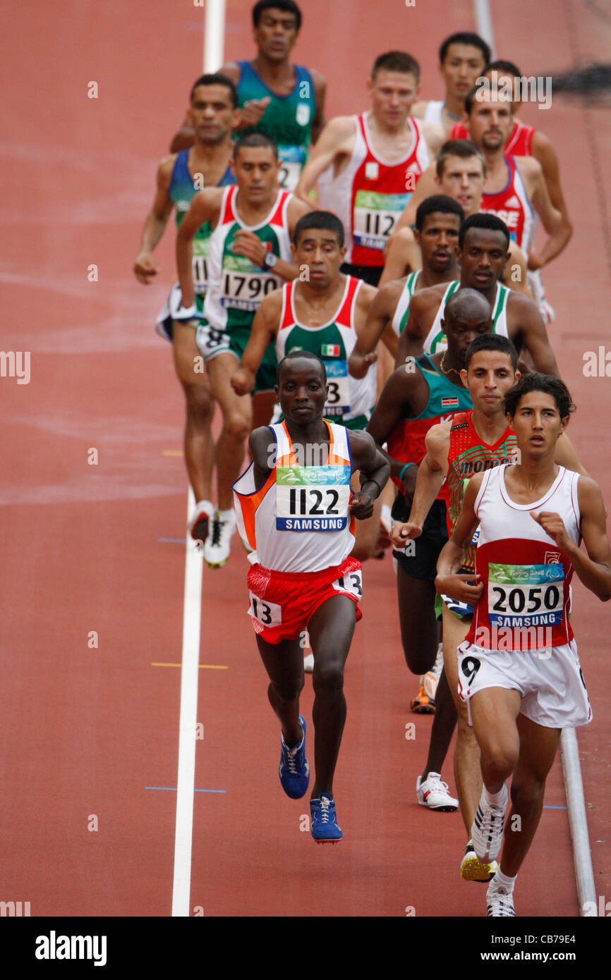 athletic competition at the 2008 Paralympic Games showing men athletes ...