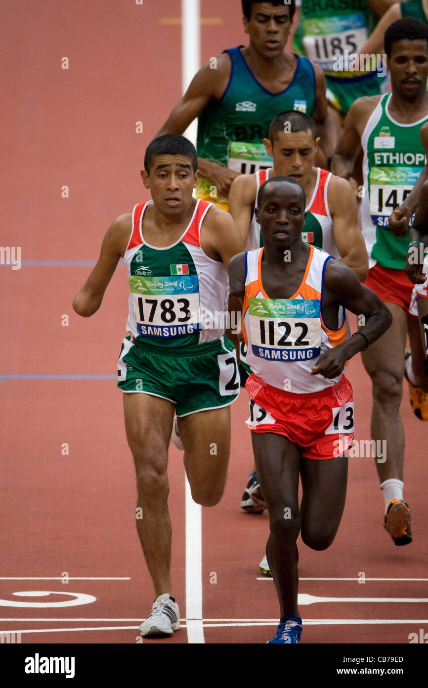 athletic competition at the 2008 Paralympic Games showing men athletes ...
