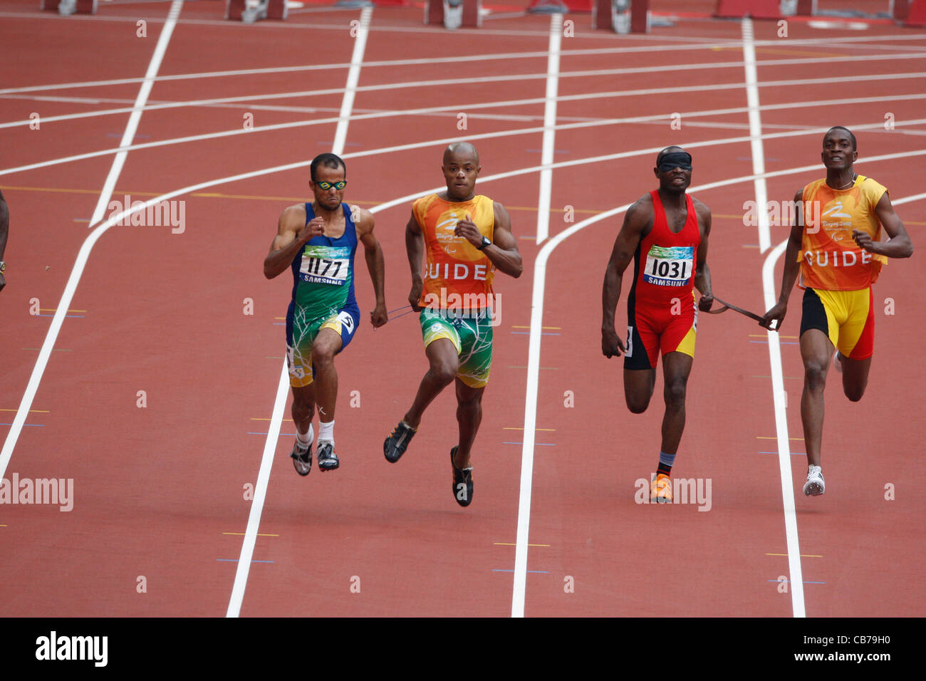athletic competition at 2008 Paralympic Games showing athlete winning ...