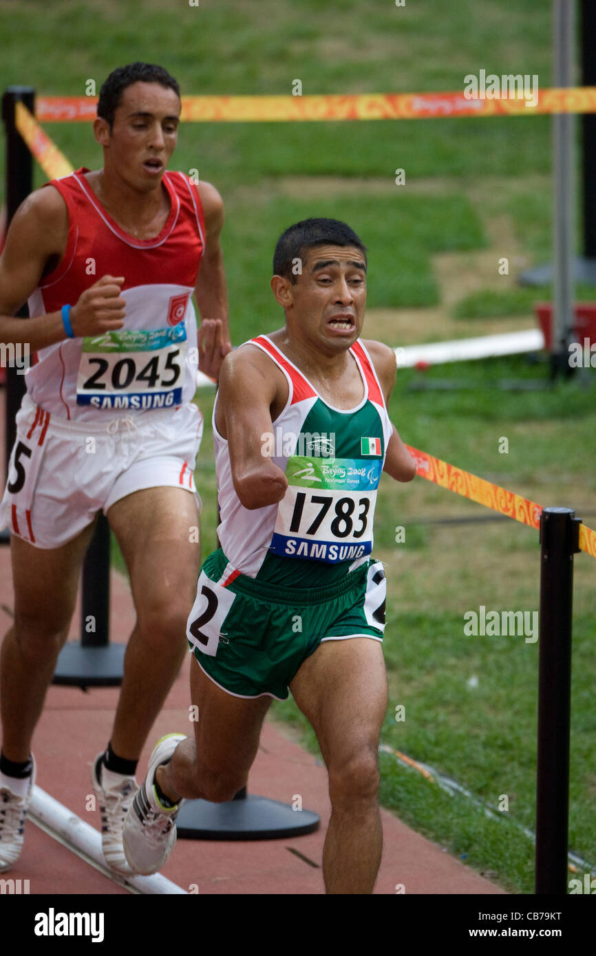 athletic competition at the 2008 Paralympic Games showing double hand ...