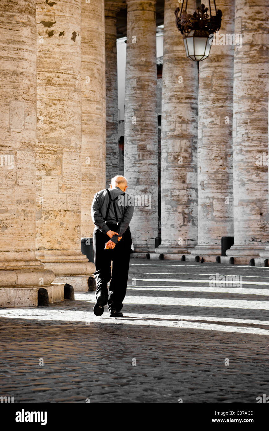 Old men walking alone in the vatican Stock Photo - Alamy