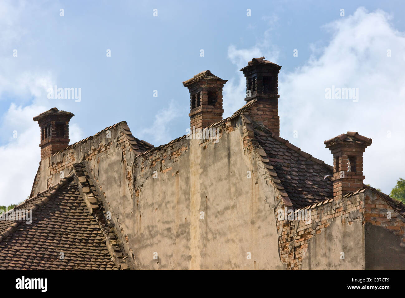 Oid house with chimneys on rooftop in Sighisoara, UNESCO World Heritage ...