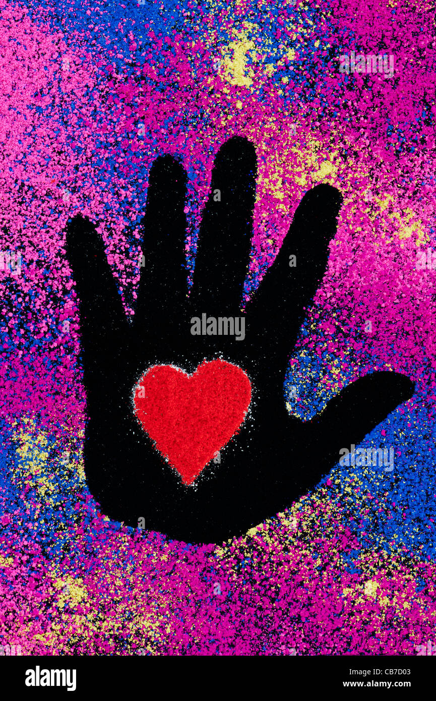 Childs hand prints with red heart shapes made with coloured powder on a ...