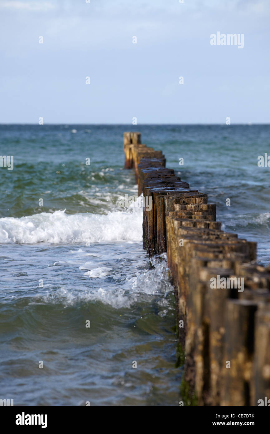 Groynes in the surf on the German Baltic coast Stock Photo - Alamy