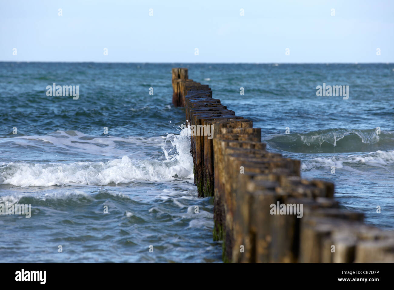 Groynes in the surf on the German Baltic coast Stock Photo - Alamy