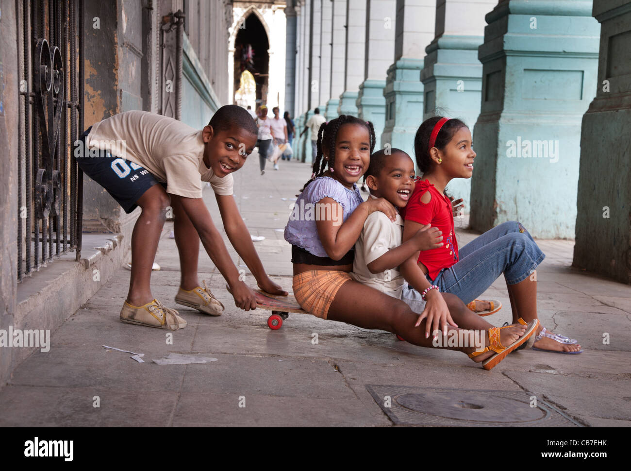 Children having fun with a skateboard by the "Recovas", Havana (La ...