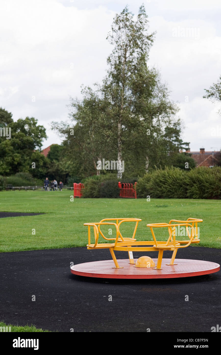 Children on playground roundabout play hi-res stock photography and ...