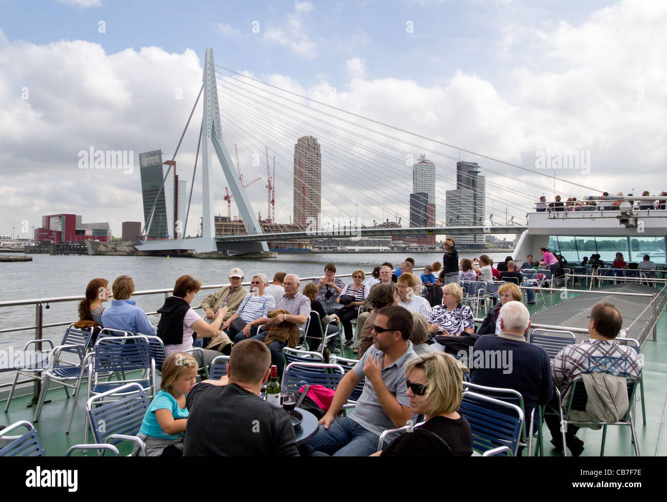 The Erasmus bridge and tourists on a Spido sightseeing boat on the ...
