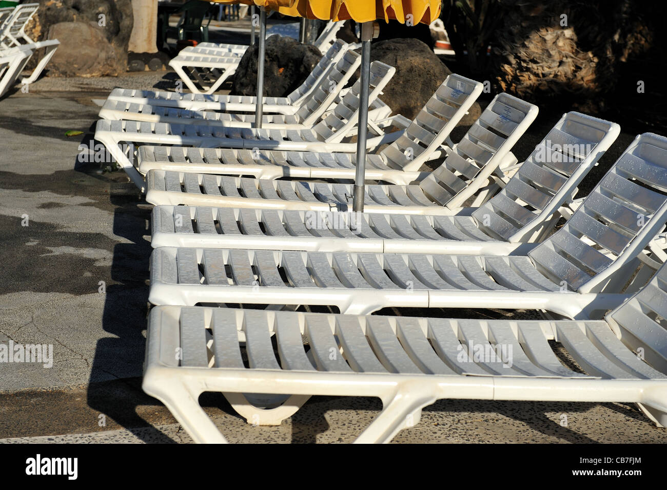 Chairs lounge in hotel after rain in a resort Stock Photo - Alamy