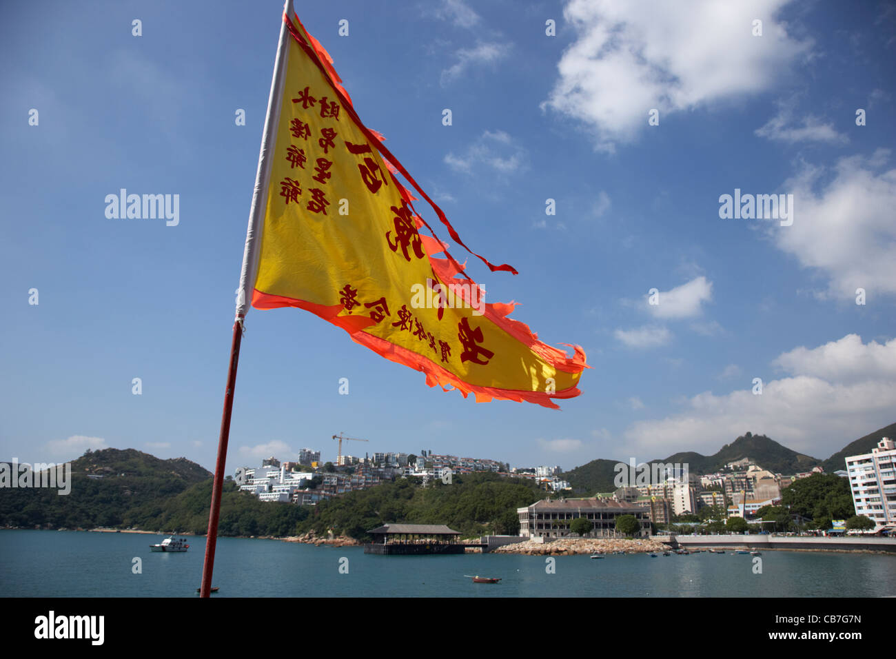 yellow triangular taoist flag flying outside shui sin temple stanley ...