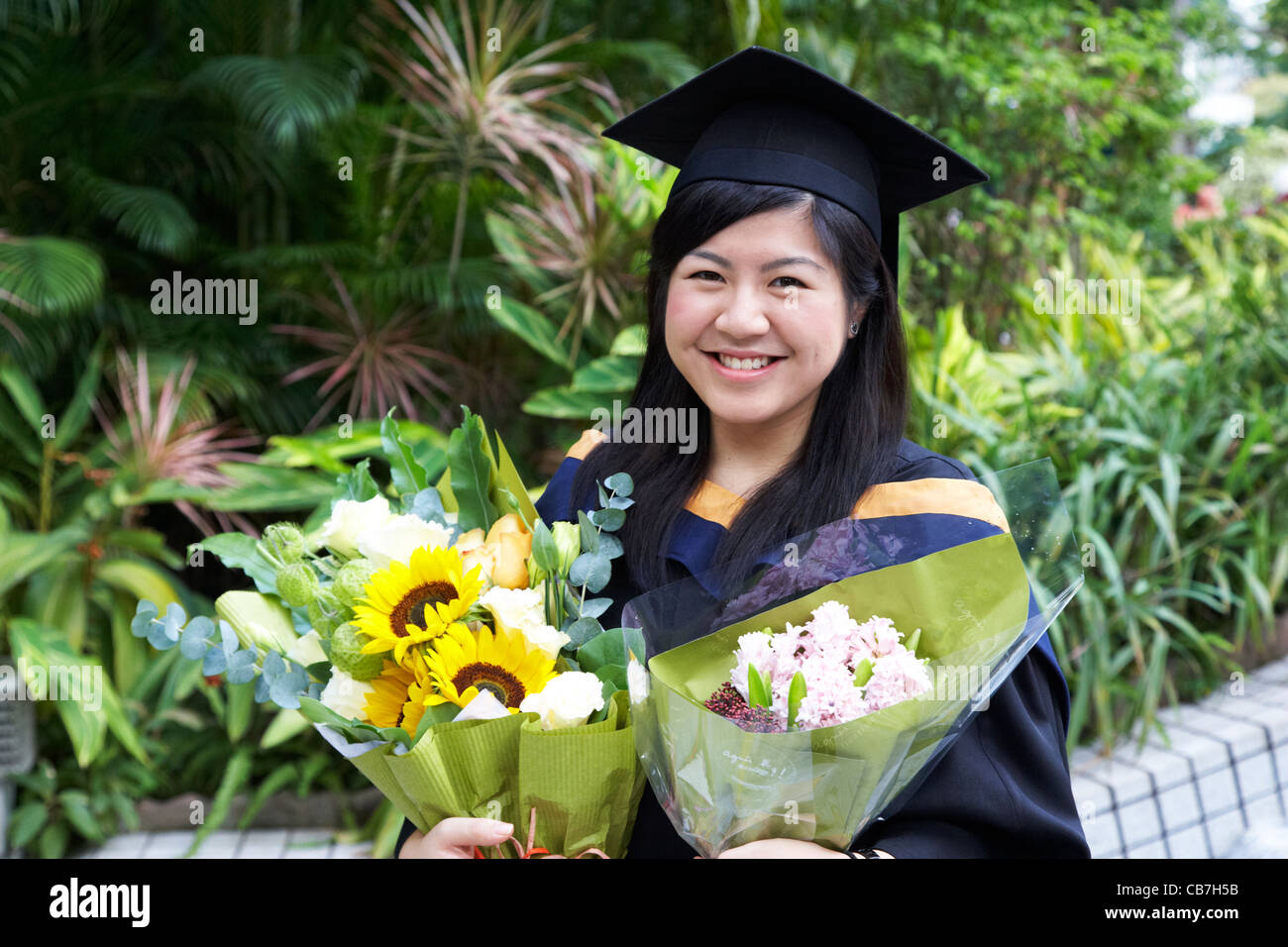 chinese female university graduate on graduation day hong kong island ...