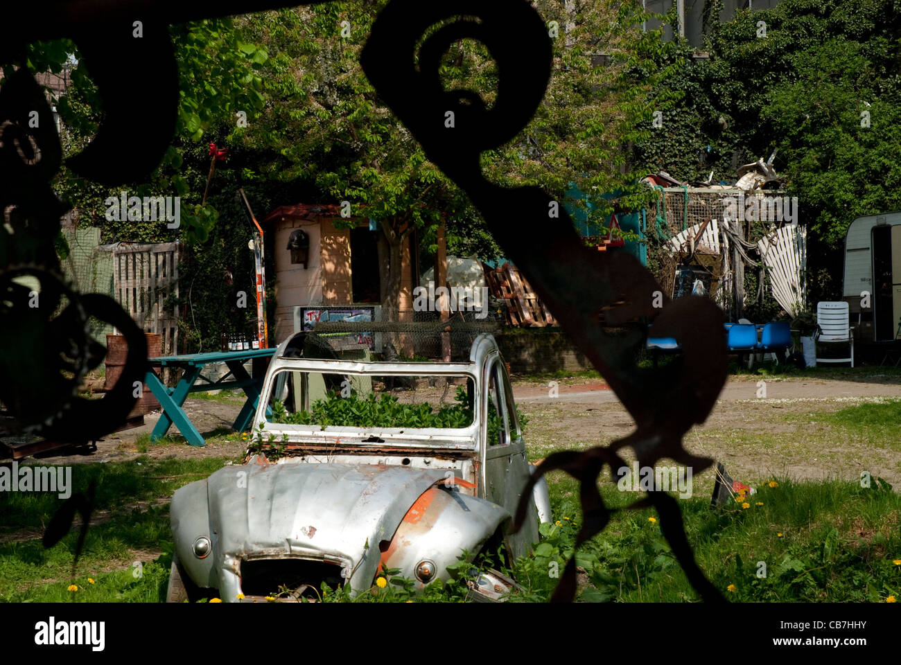 An old 2CV being used as a growing space in a squatters garden Stock ...