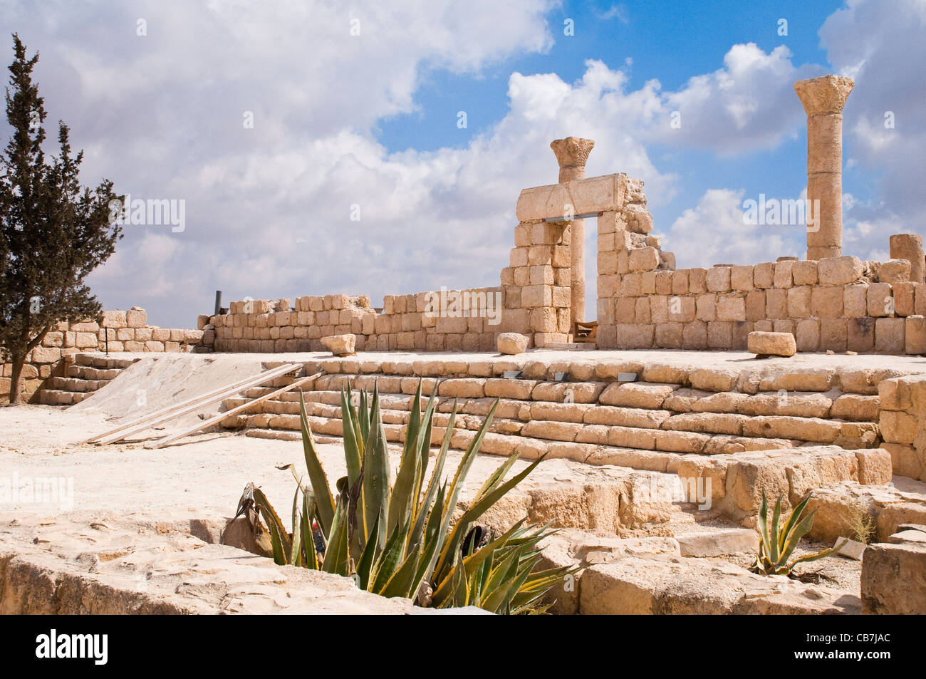 ancient desert ruins with blue sky in background Stock Photo - Alamy