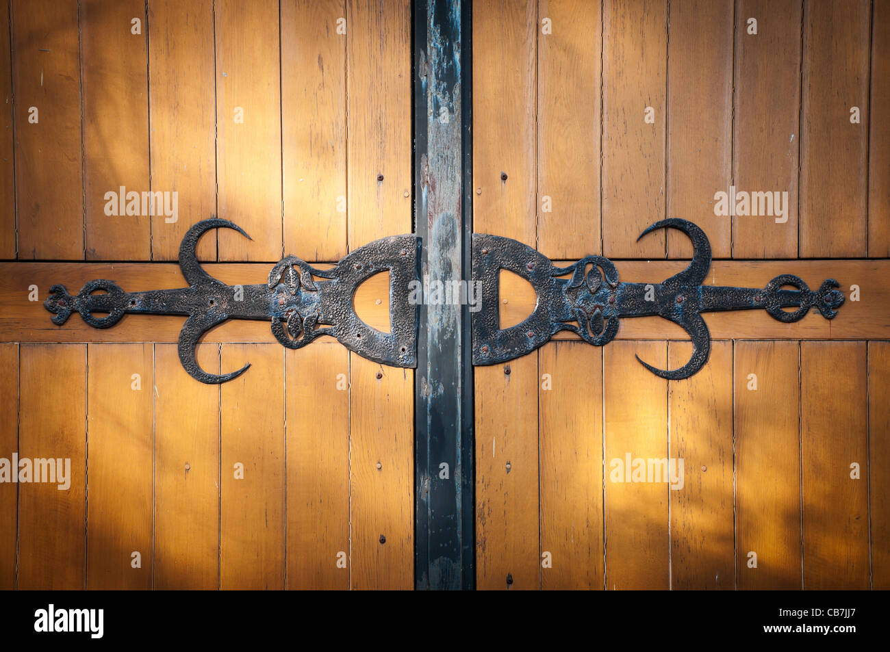 old beautiful wooden gate with ornate iron lock Stock Photo - Alamy