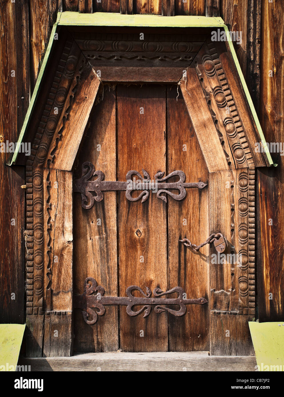 old beautiful wooden gate with ornate iron lock Stock Photo - Alamy